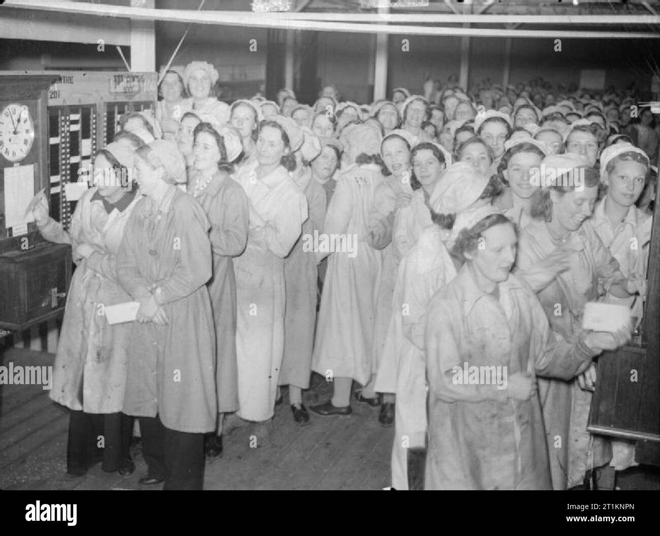 Munitions Production in Britain, 1940- Clocking Off A large group of ...