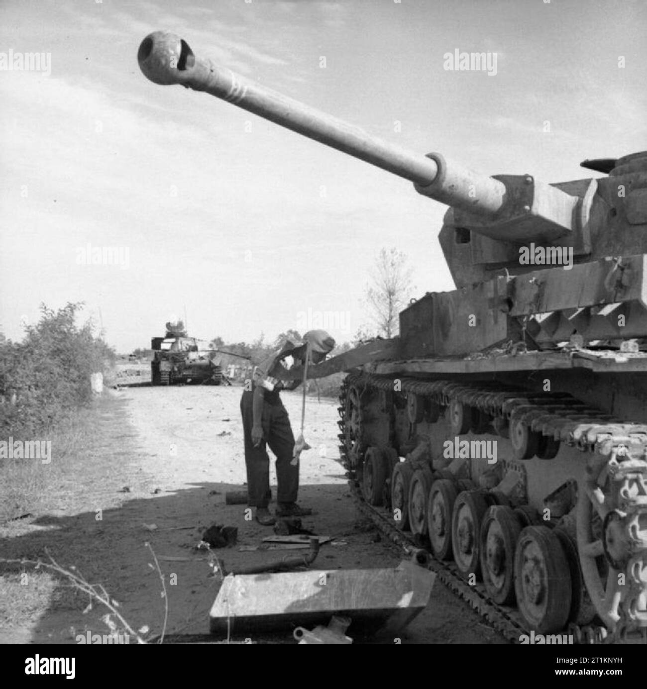 The British Army in Italy 1944 A soldier inspects a pair of German ...