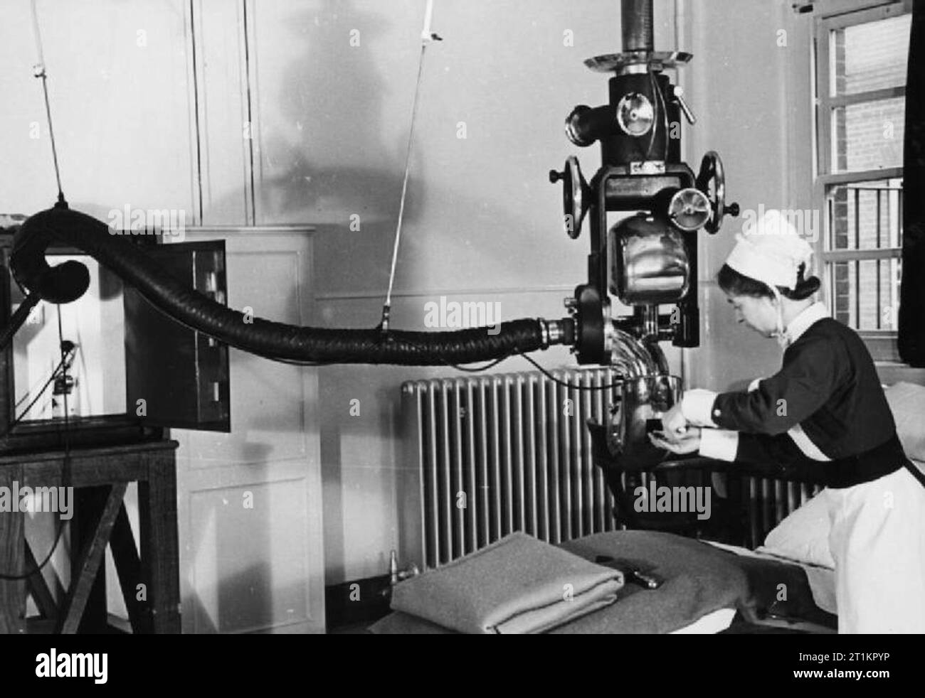 Radium Treatment in a London Hospital, England, 1940 A nurse prepares ...