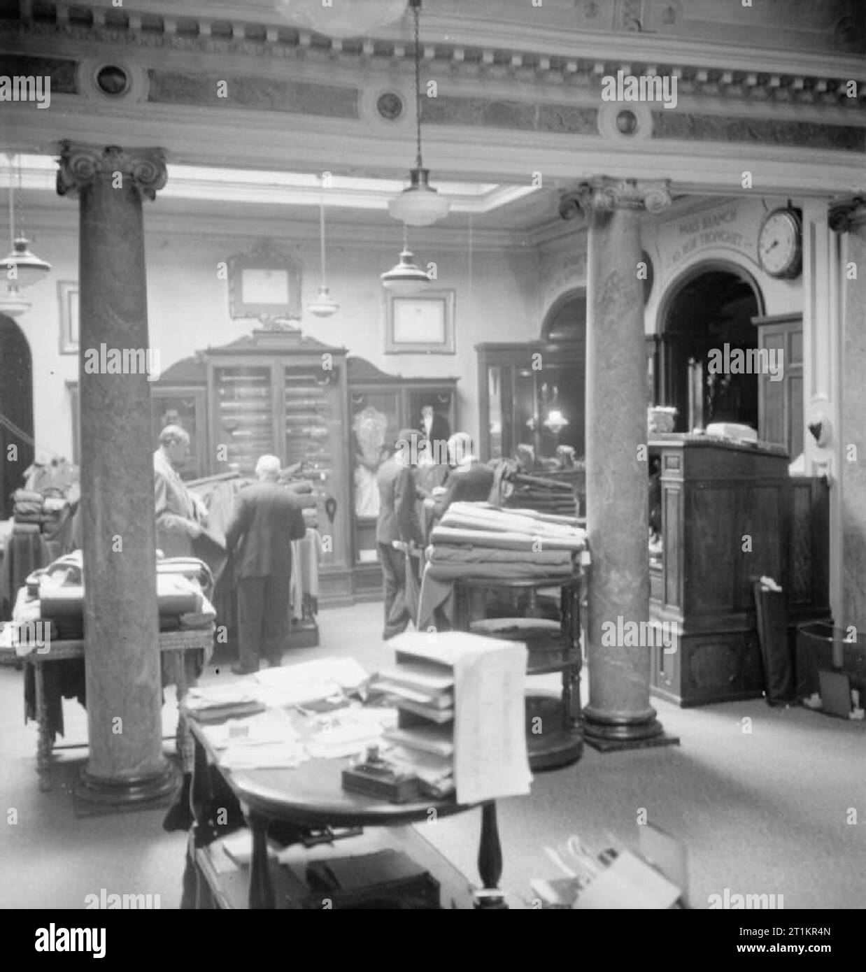 Savile Row- Tailoring at Henry Poole and Co., London, England, UK, 1944 Customers examine the ...