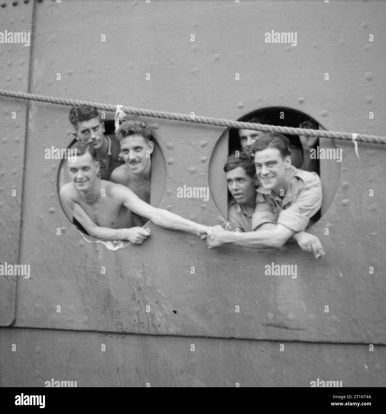The British Army in Malaya 1941 British troops look out from portholes ...