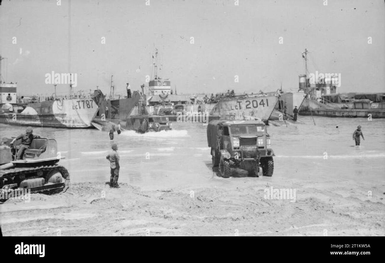The British Army in Normandy 1944 Lorries coming ashore from tank ...