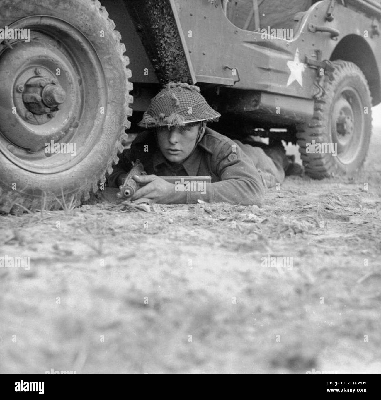The British Army in Normandy 1944 A soldier armed with a Sten gun takes ...