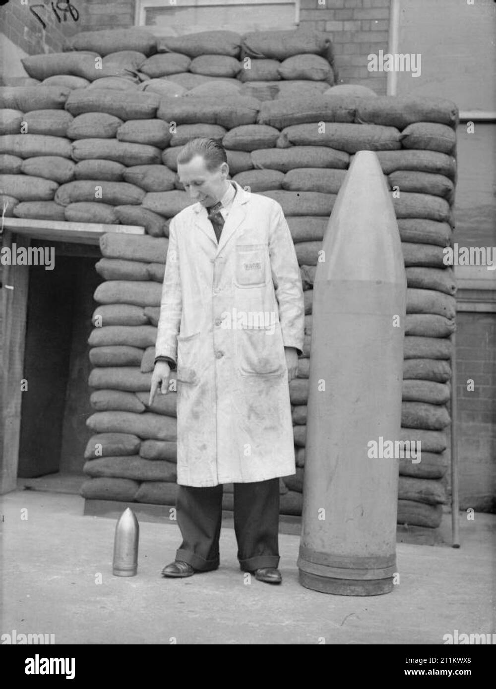 At work in a British Shell Factory, England, C 1940 A munitions worker ...