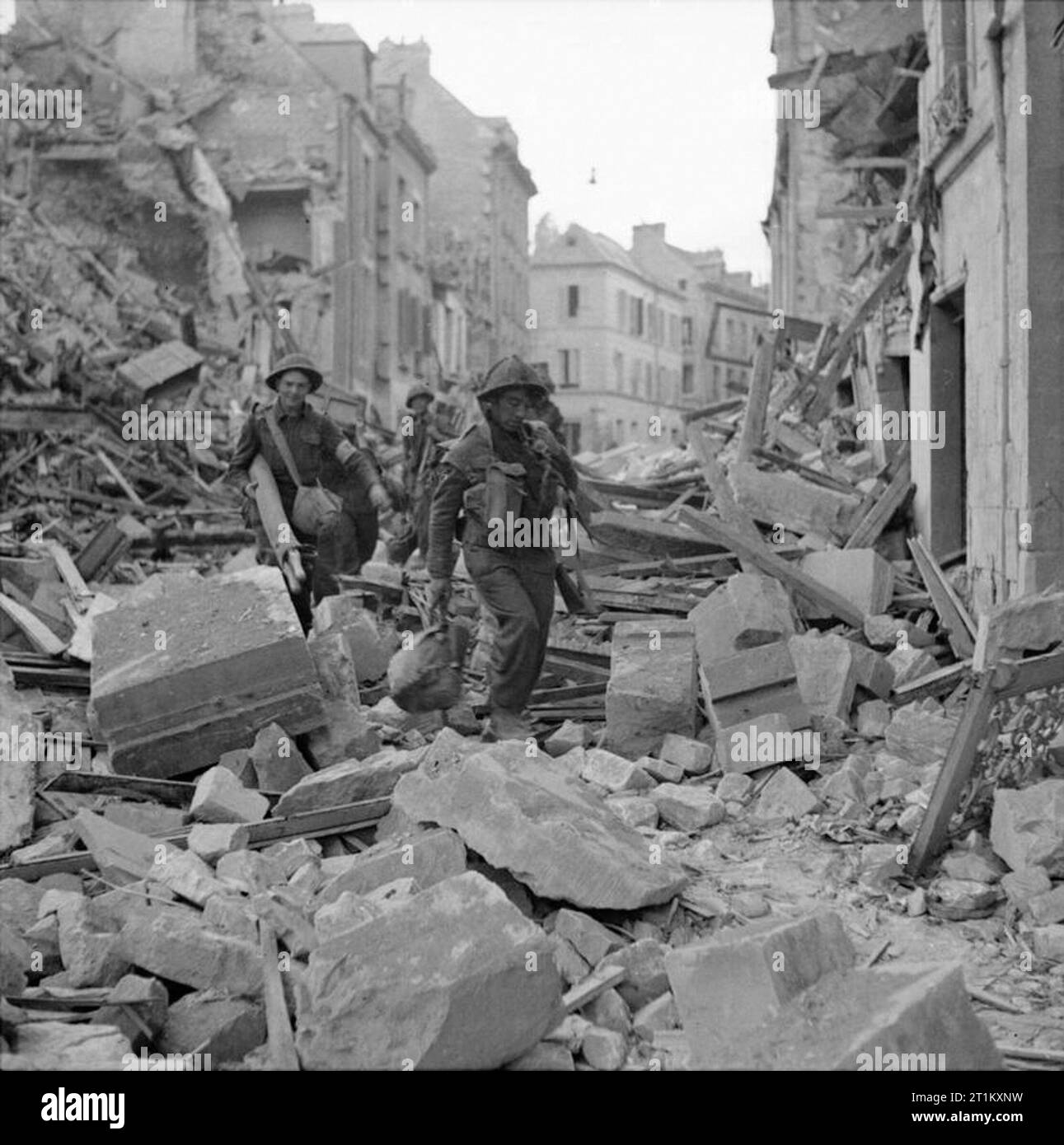 The British Army in Normandy 1944 Troops pick their way through the ...