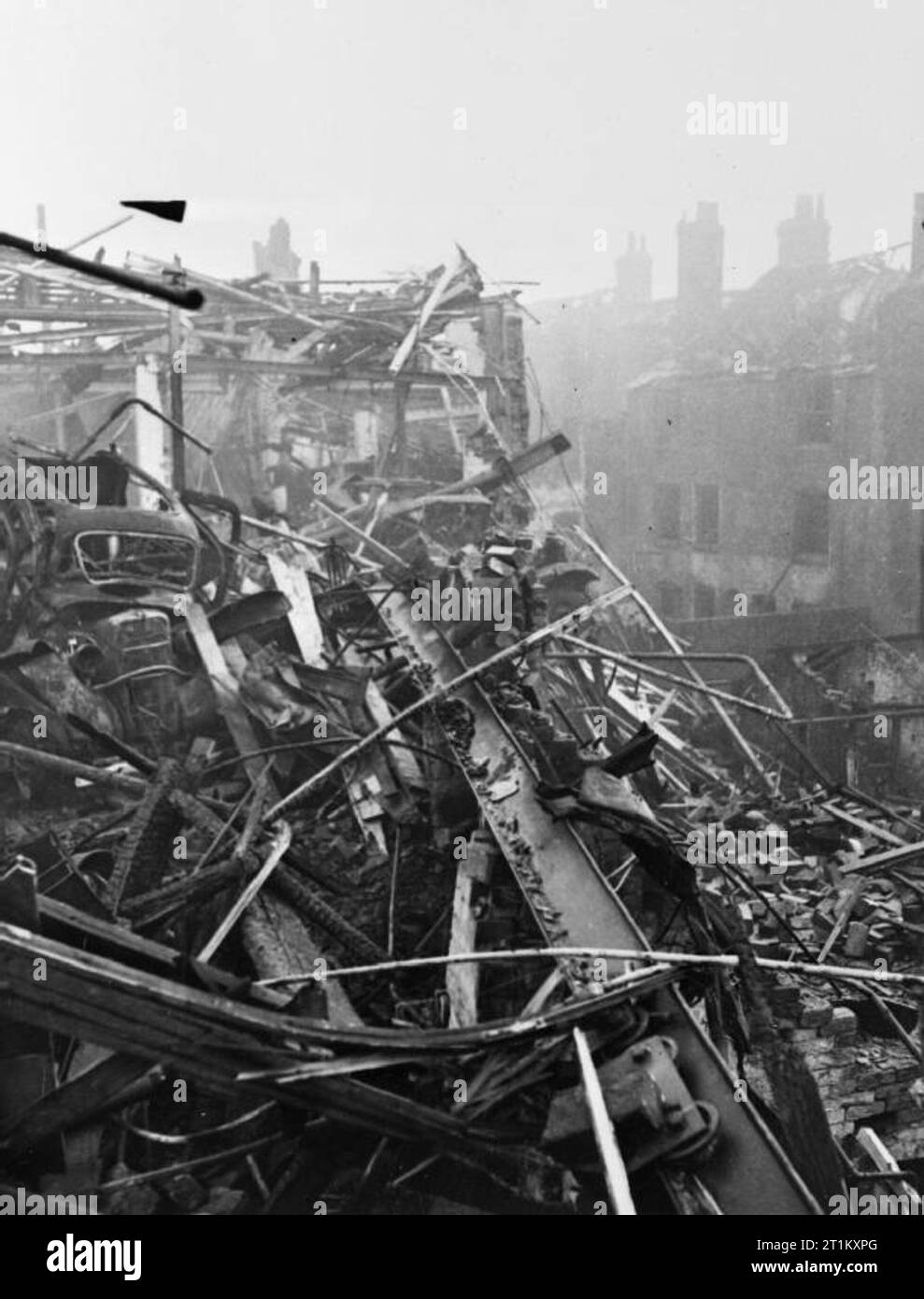 Bomb Damage in Birmingham, England, 1940 A pile of girders, timber and ...