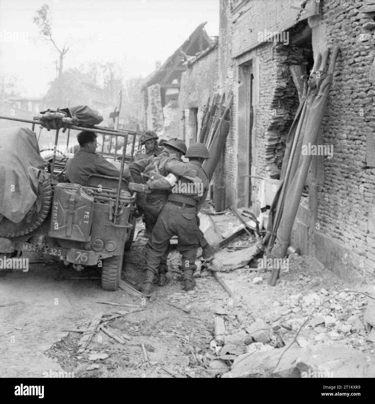 The British Army in Normandy 1944 A casualty is brought in by jeep to a ...