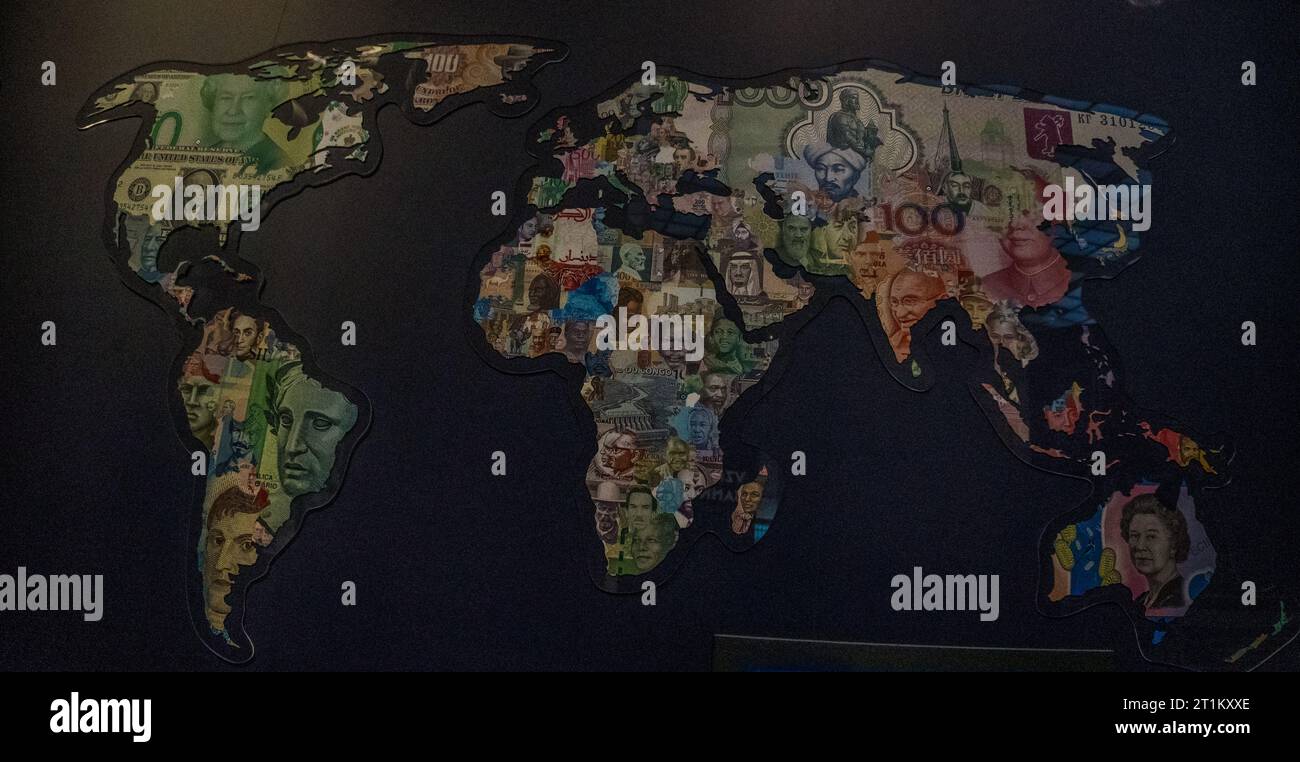 World map with continents made from money of different countries on ...