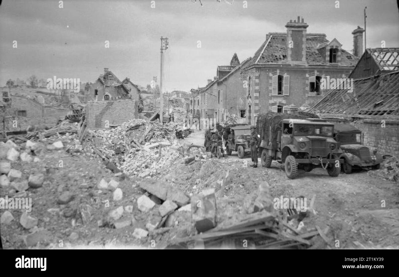 The British Army in Normandy 1944 A jeep and trucks parked in a ...