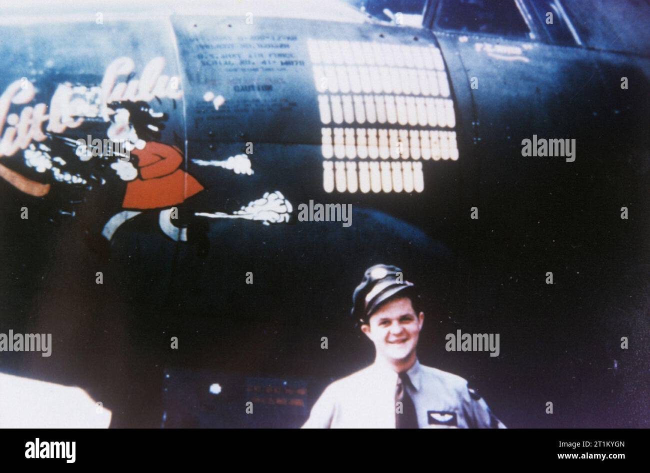 An airman of the 323rd Bomb Group with a B-26 Marauder (serial number ...
