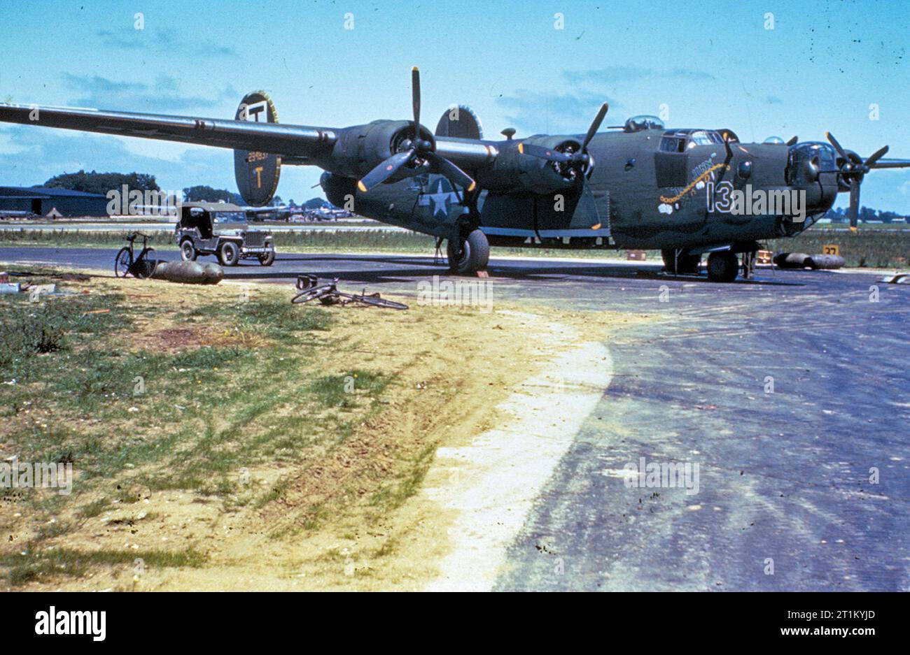 Ground personnel of the 490th Bomb Group work on a B-24 Liberator ...