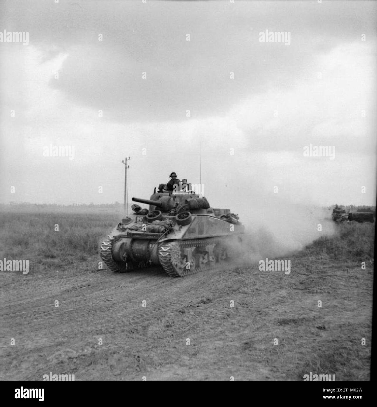 The British Army in Normandy 1944 A Sherman tank advances during ...