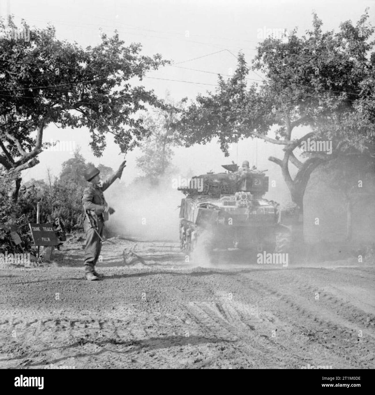 The British Army in Normandy 1944 A military policeman controls traffic ...