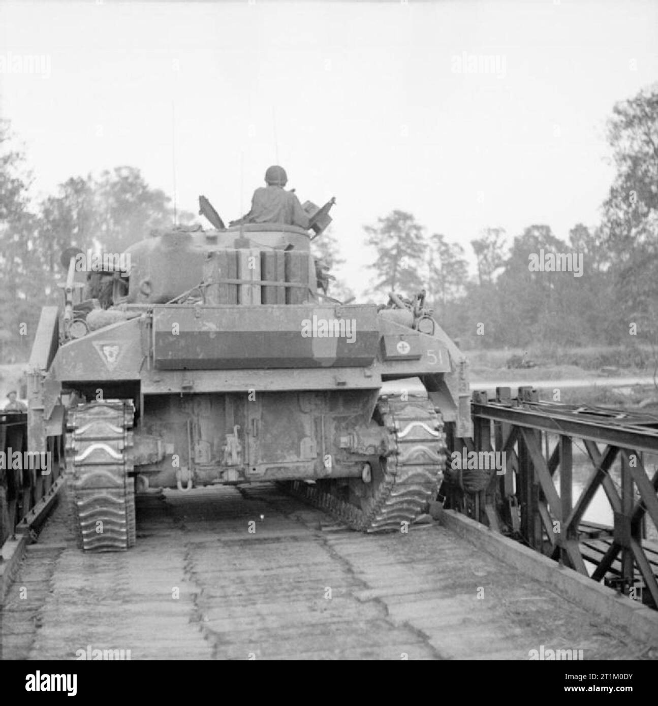 The British Army in Normandy 1944 A Sherman Crab flail tank crosses a ...