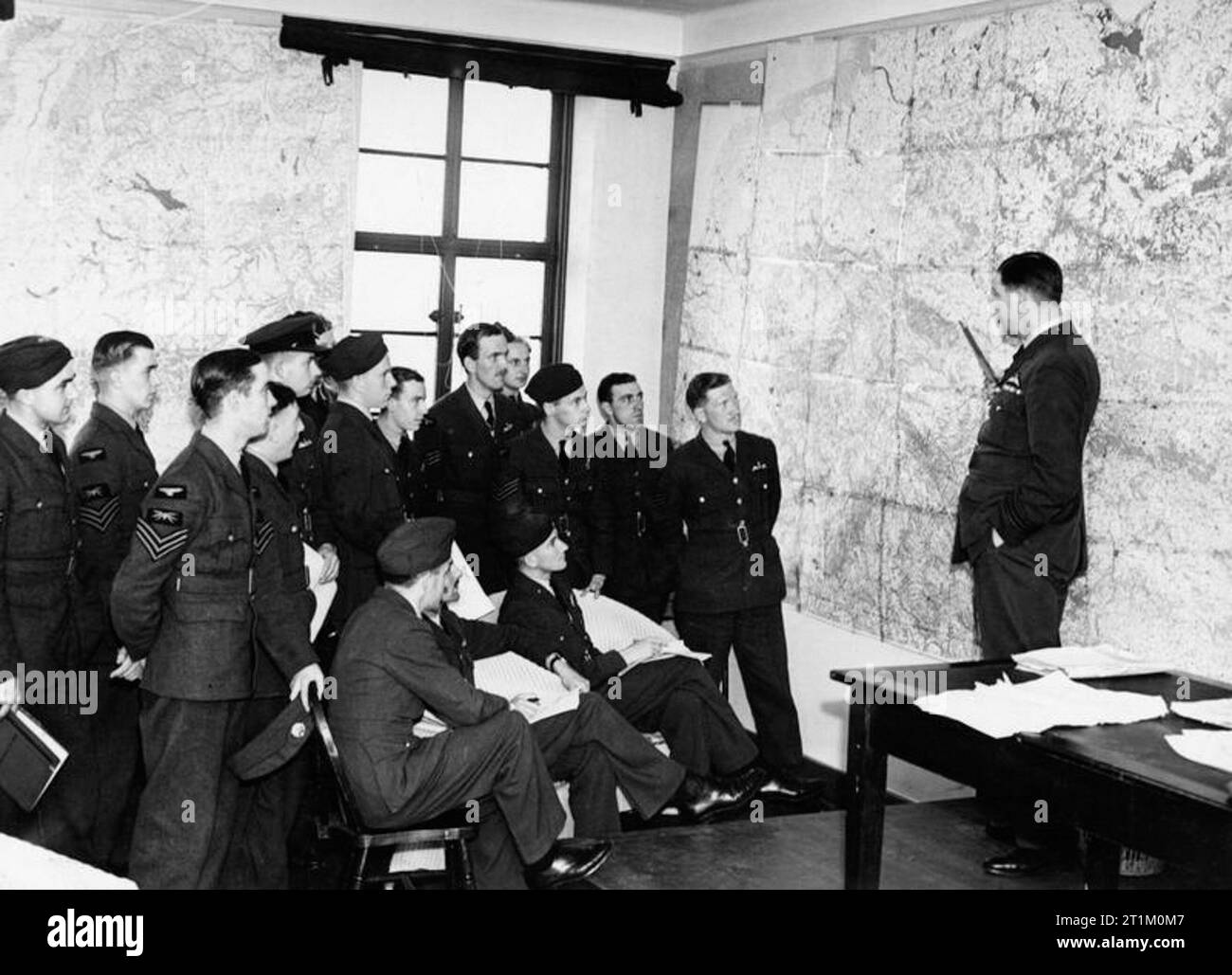 RAF Bomber Command 1940 Whitley bomber crews attend a briefing before a ...