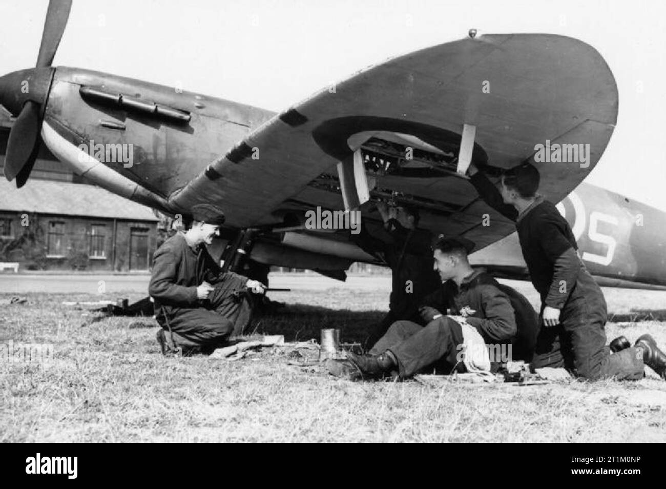 RAF Fighter Command 1940 Ground staff re-arm a Spitfire Mk I at Biggin ...