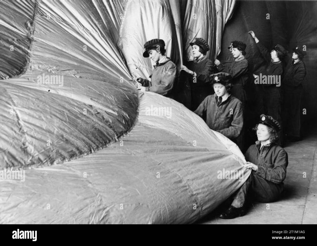Women's Auxiliary Air Force, 1940 A group of repair workers mend a ...