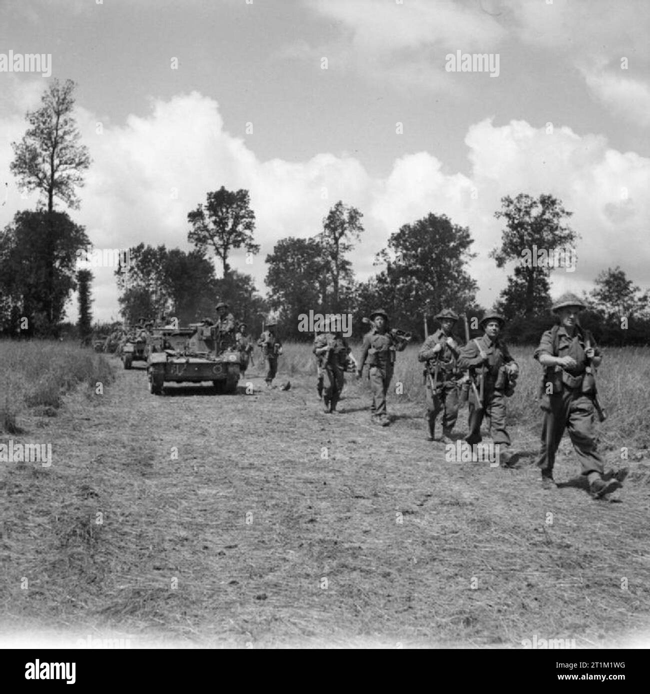 The British Army in Normandy 1944 Universal carriers and infantry of ...