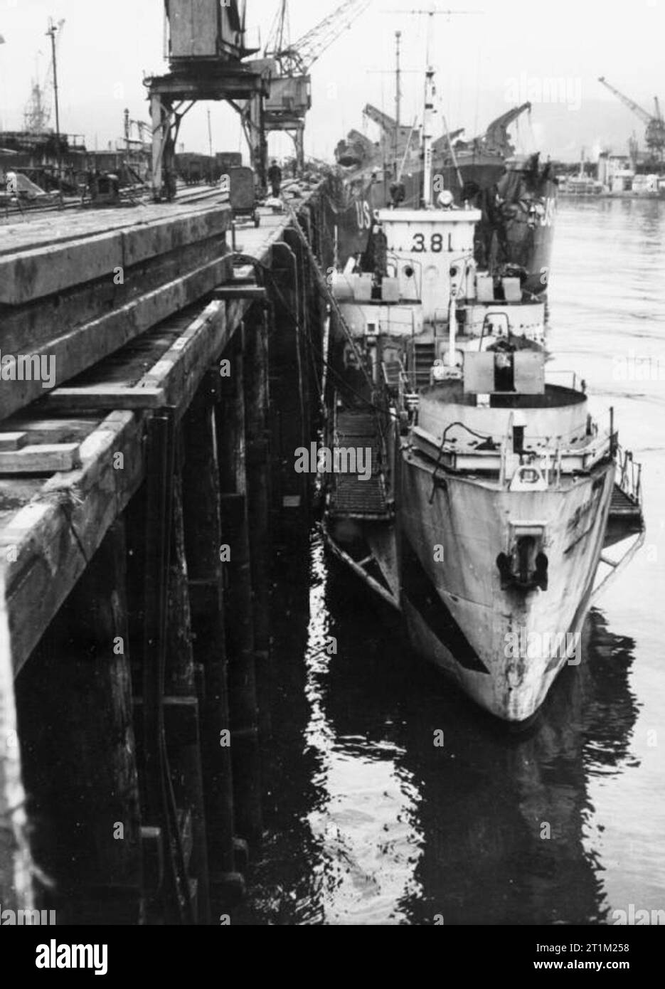 Lcq 381 Alongside a jetty with damaged Landing Ship Tank (US) 501 ...