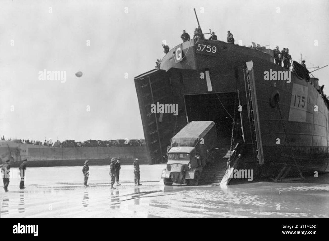 USS LST 175 unloading a military lorry on a beach in Normandy, 7 June ...
