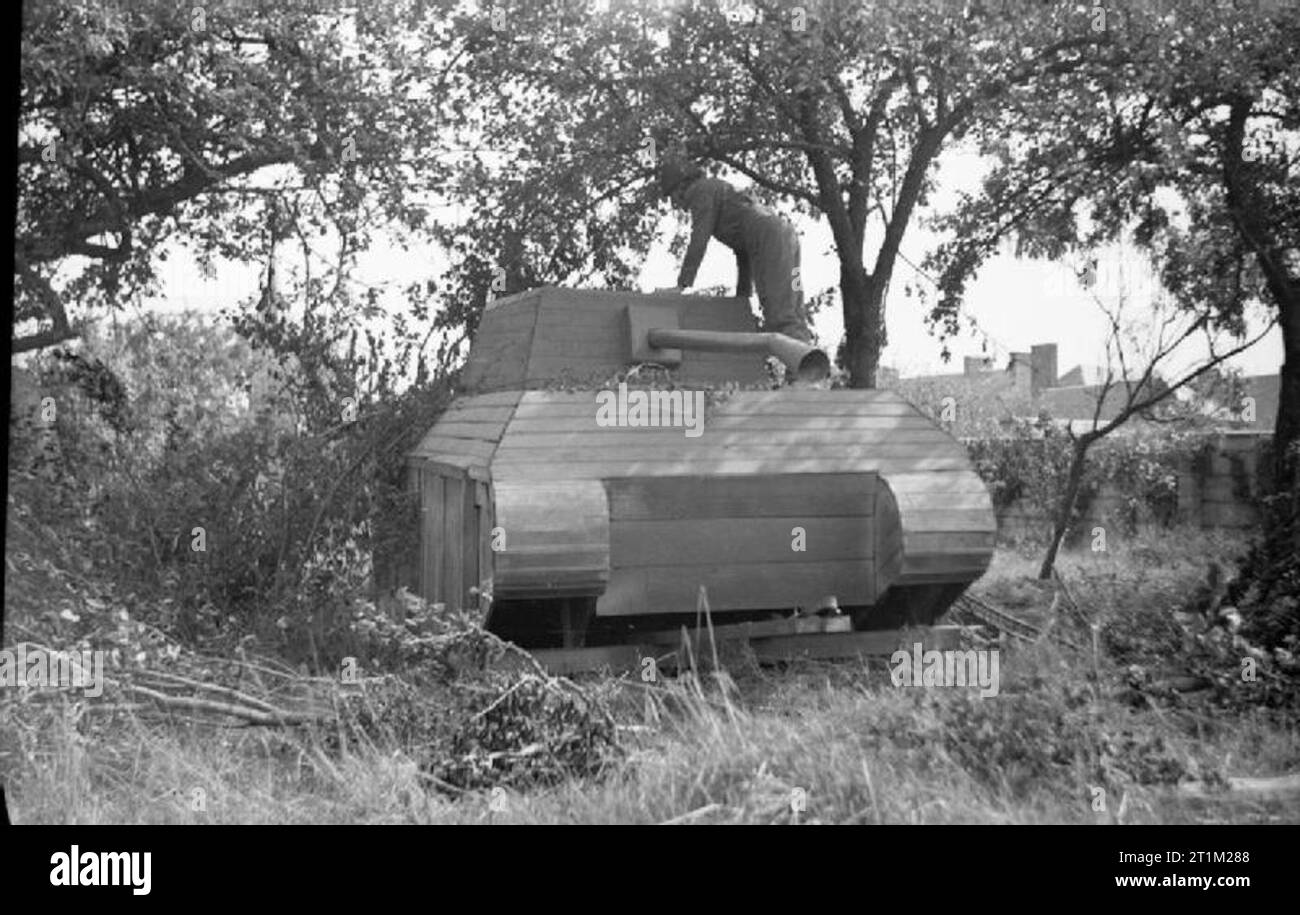 The British Army in Normandy 1944 An officer inspects a German dummy ...
