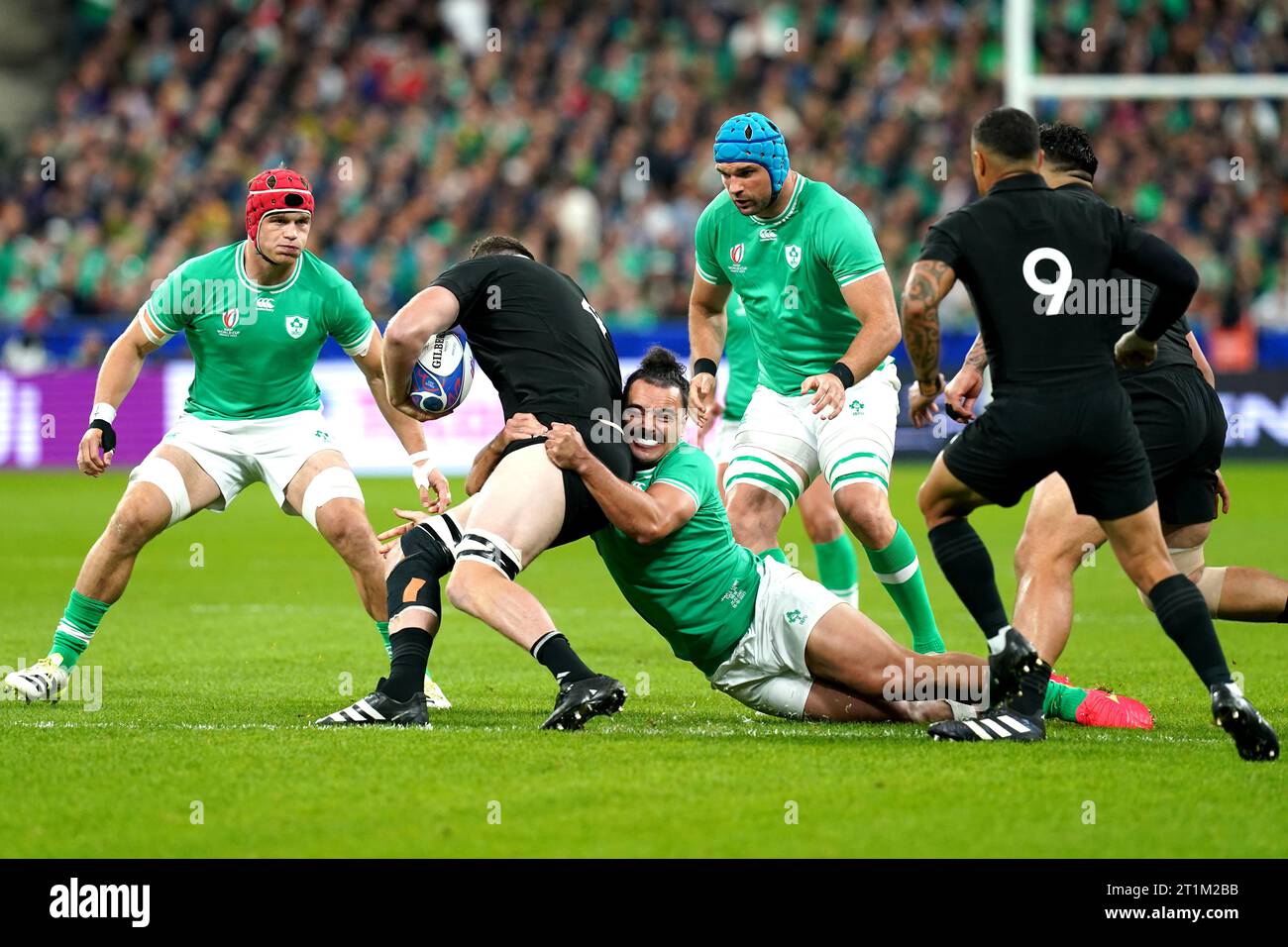 New Zealand's Brodie Retallick is tackled by Ireland's James Lowe ...