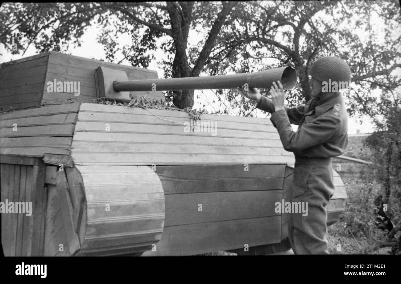 The British Army in Normandy 1944 An officer inspects a German dummy ...