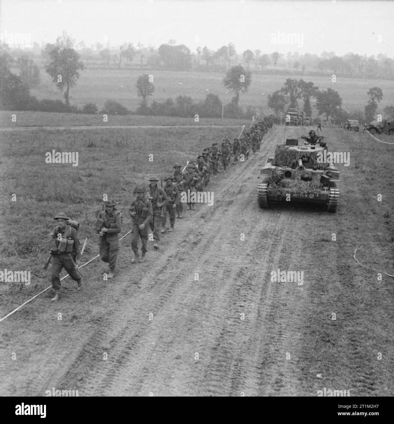 The British Army in Normandy 1944 A Cromwell tank and infantry advance ...