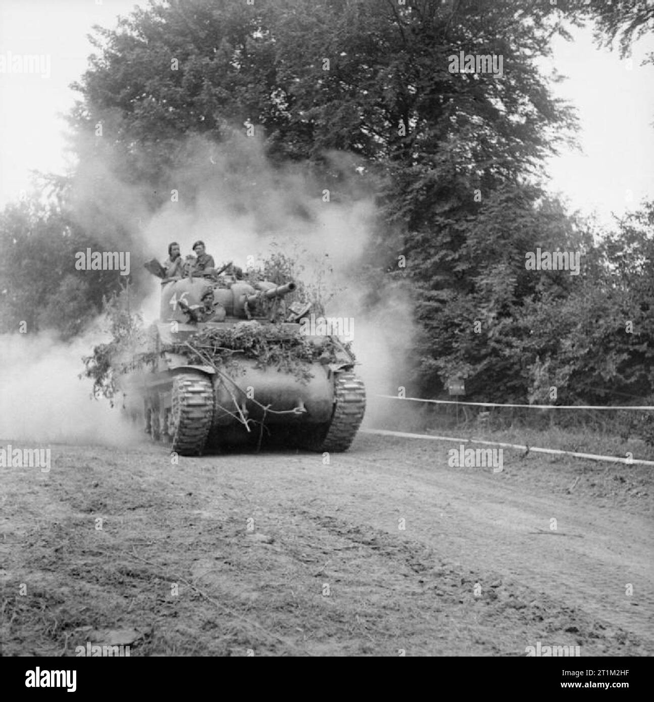 The British Army in Normandy 1944 A Sherman tank advances near ...