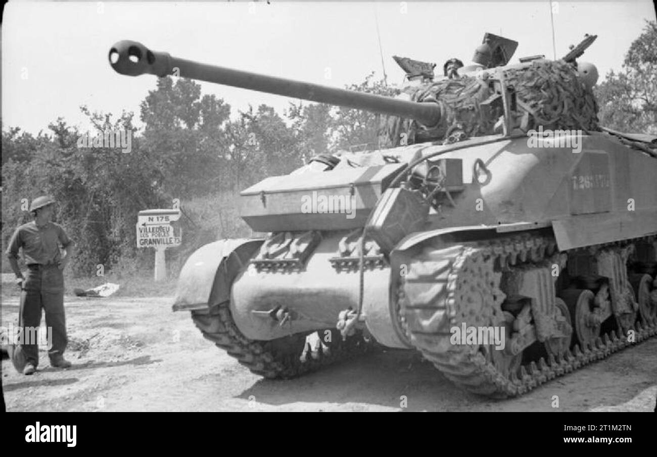 The British Army in Normandy 1944 A Sherman Firefly advances towards ...