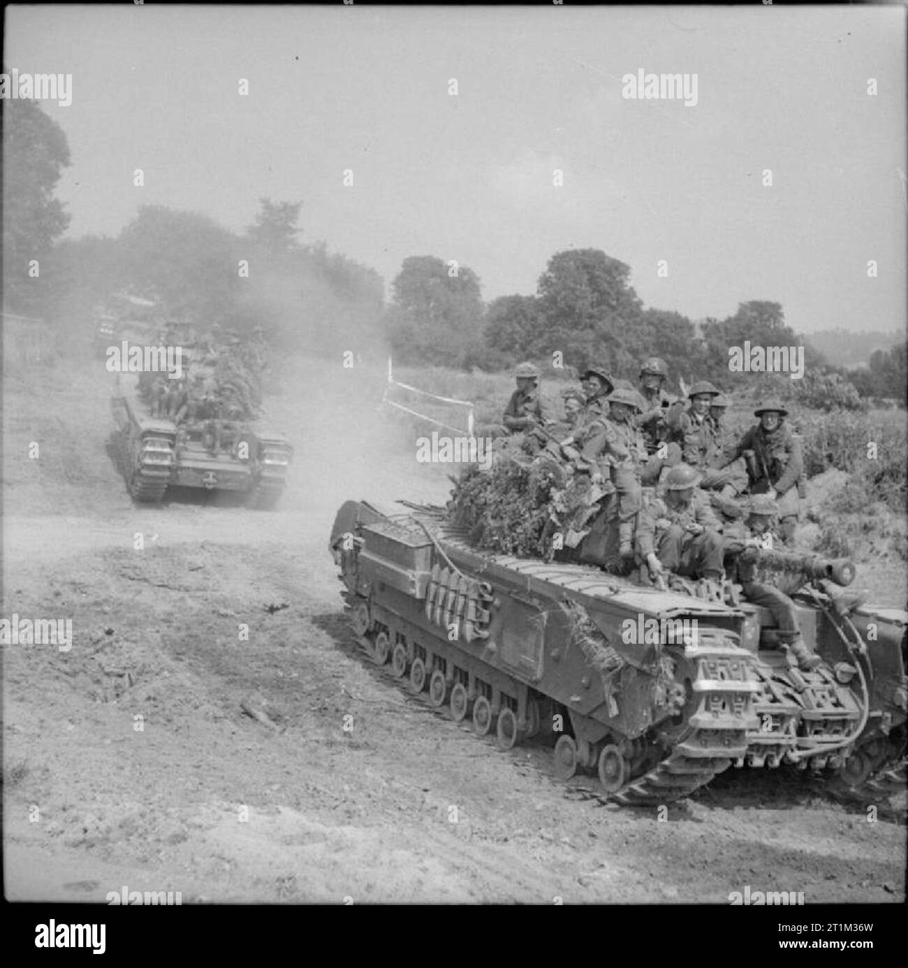The British Army in Normandy 1944 Churchill tanks carrying infantry ...