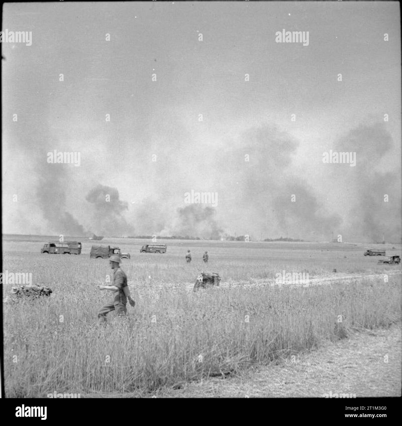 The British Army in Normandy 1944 Smoke rises in the distance after a ...