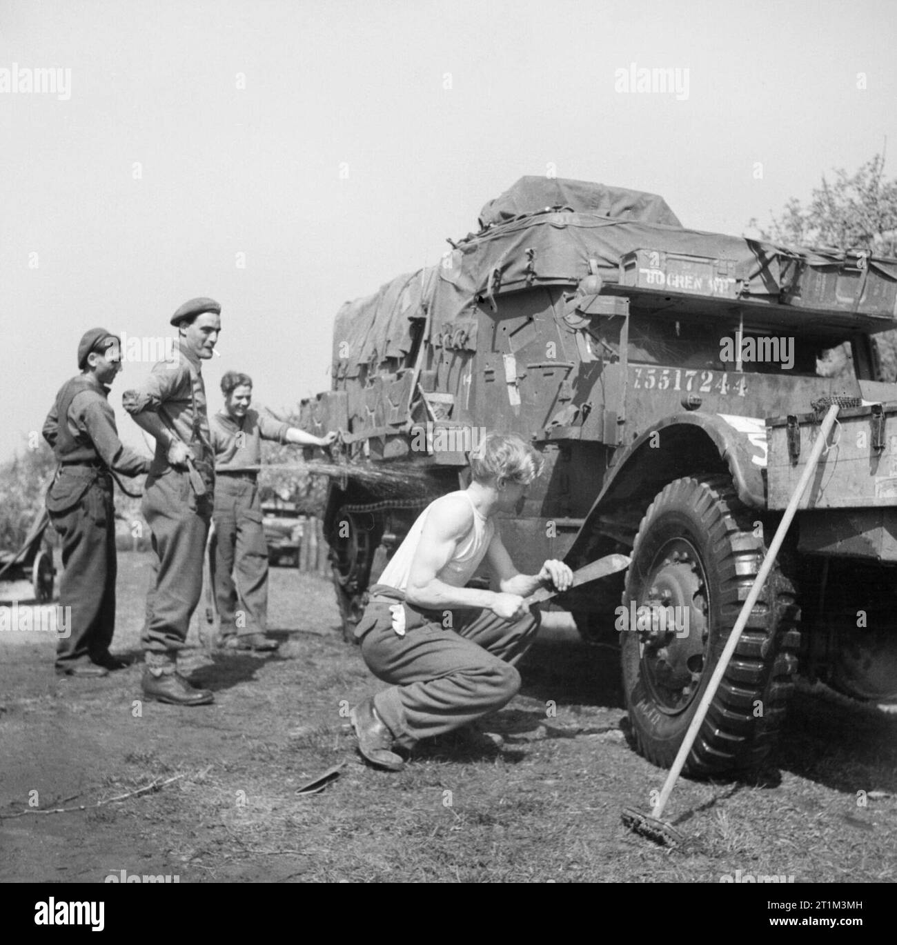 Former slave workers assist British soldiers from 1st Rifle Brigade to ...