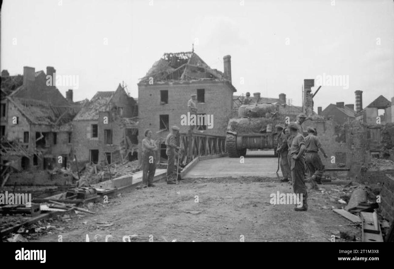 The British Army in Normandy 1944 A Sherman tank crossing the newly ...