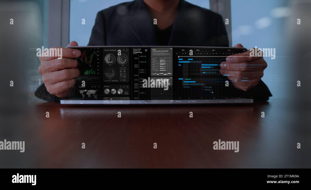 businessman open laptop screen at desk with digital business chart ...