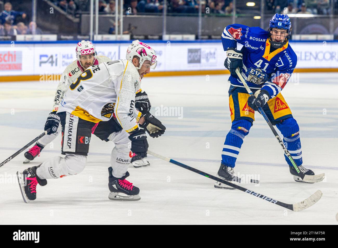 Leon Muggli #41 (EV Zug) finds a teammate with his pass during the ...