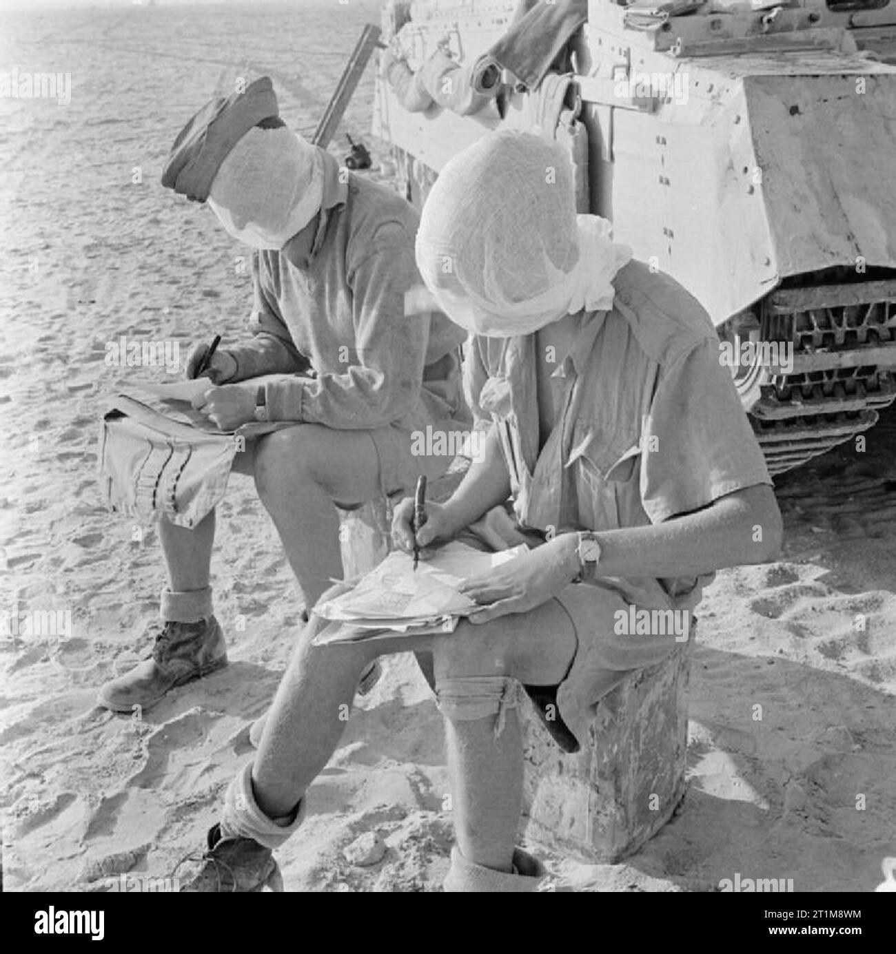 The British Army in North Africa 1942 Two members of a Crusader tank's ...