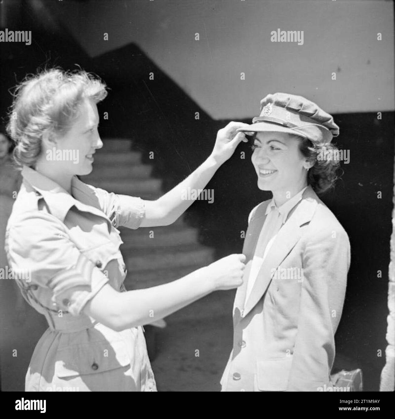 The British Army in North Africa 1943 A new ATS girl tries on her cap ...