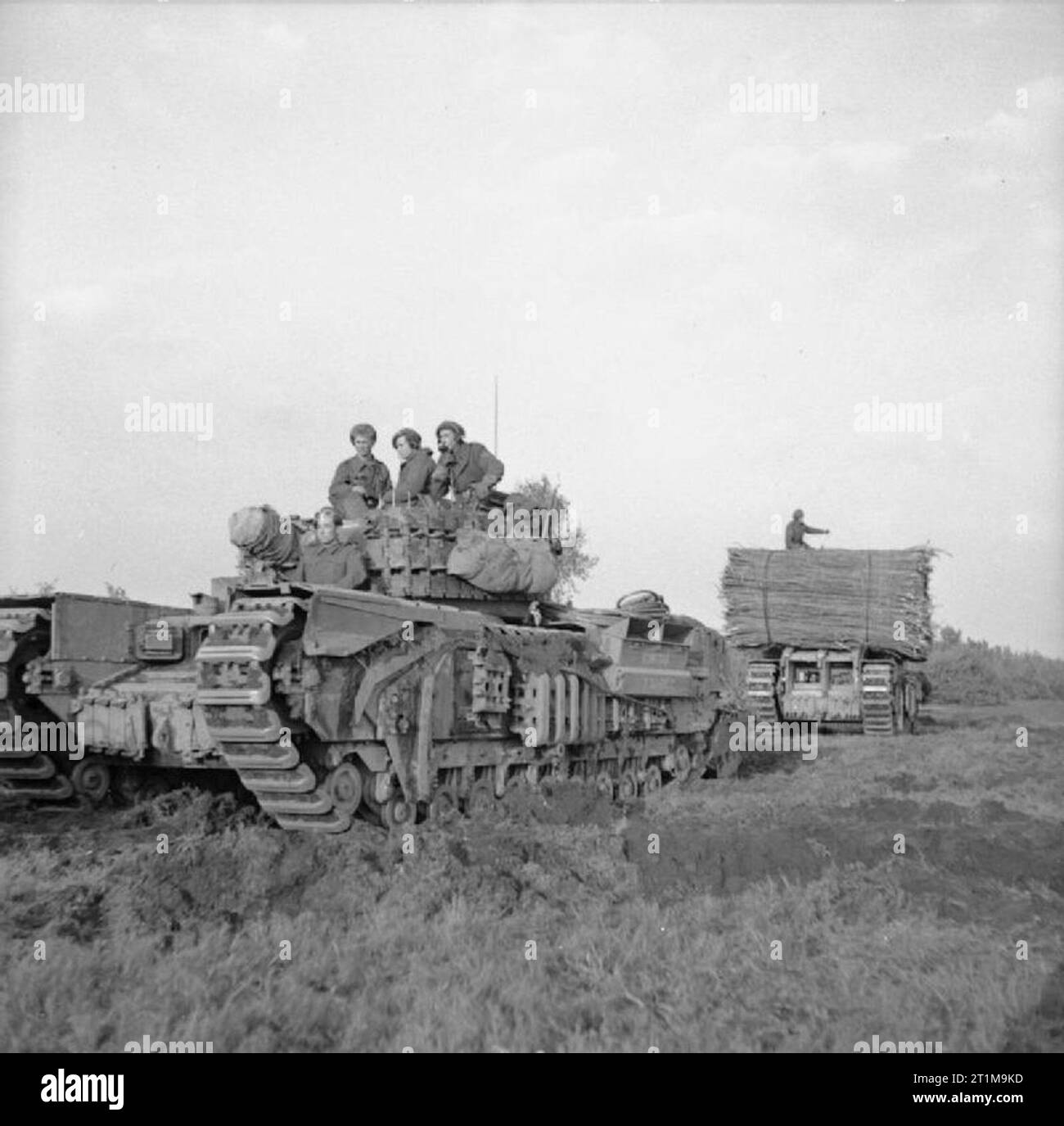 The British Army in North-west Europe 1944-45 Churchill AVRE towing a ...