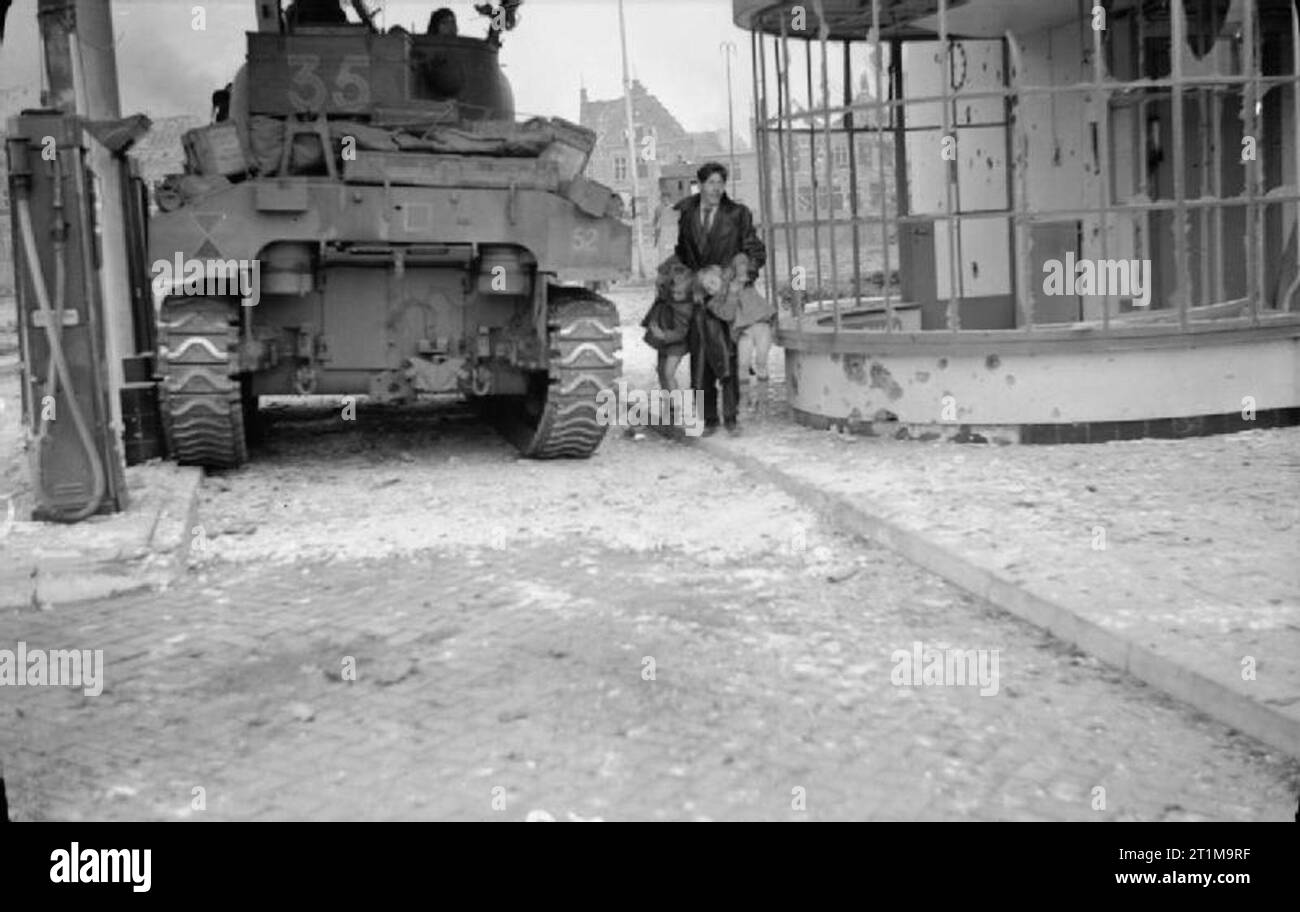 The British Army in North-west Europe 1944-45 A Dutch civilian lifts ...