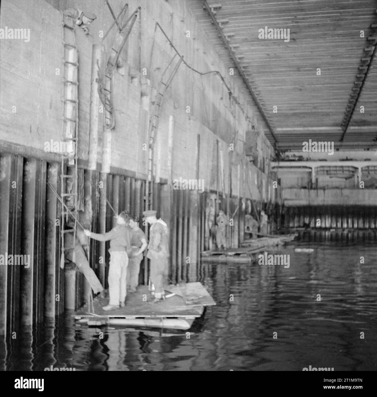 Germany Under Allied Occupation Working from rafts on the water ...