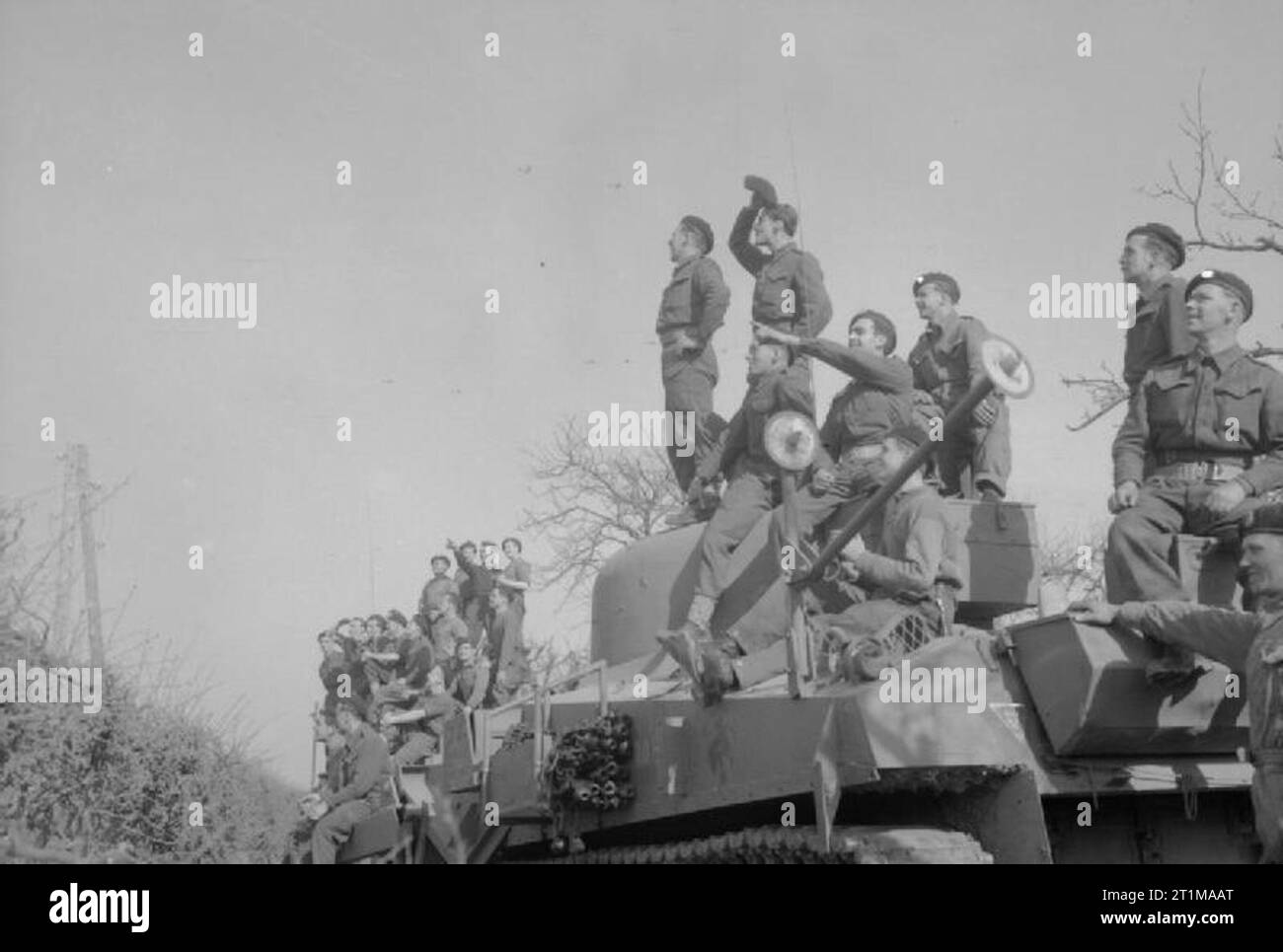 The British Army in North-west Europe 1944-45 Troops stand on a Sherman ...