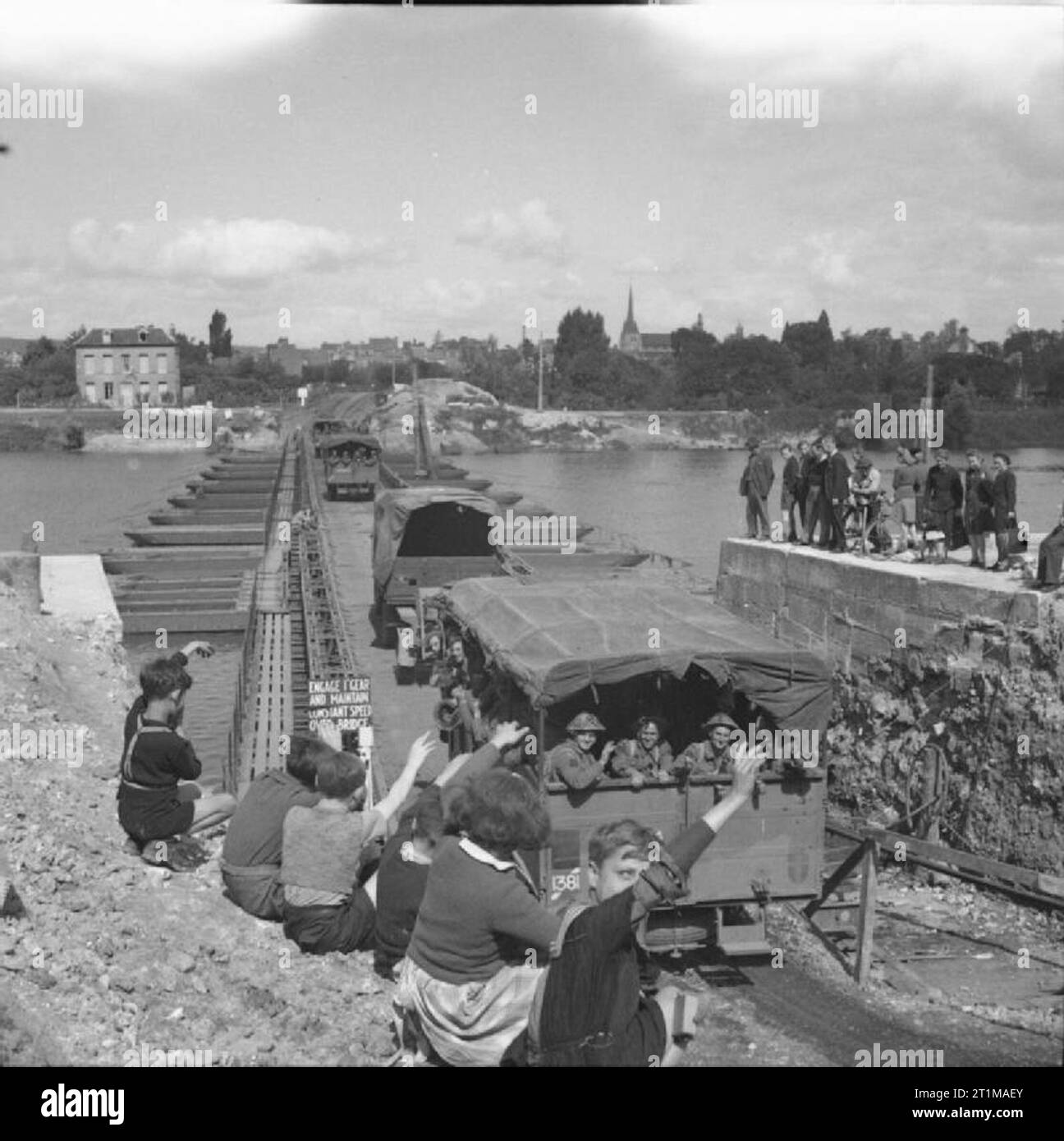 The British Army in North-west Europe 1944-45 Children wave as lorries ...