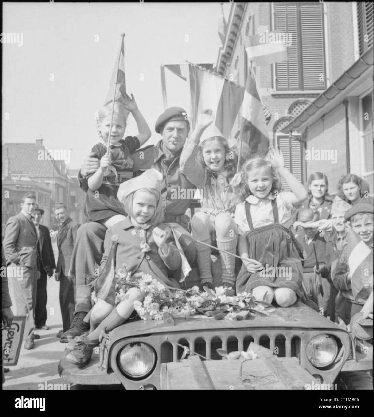 The British Army in North-west Europe 1944-45 Dutch children ride on a ...