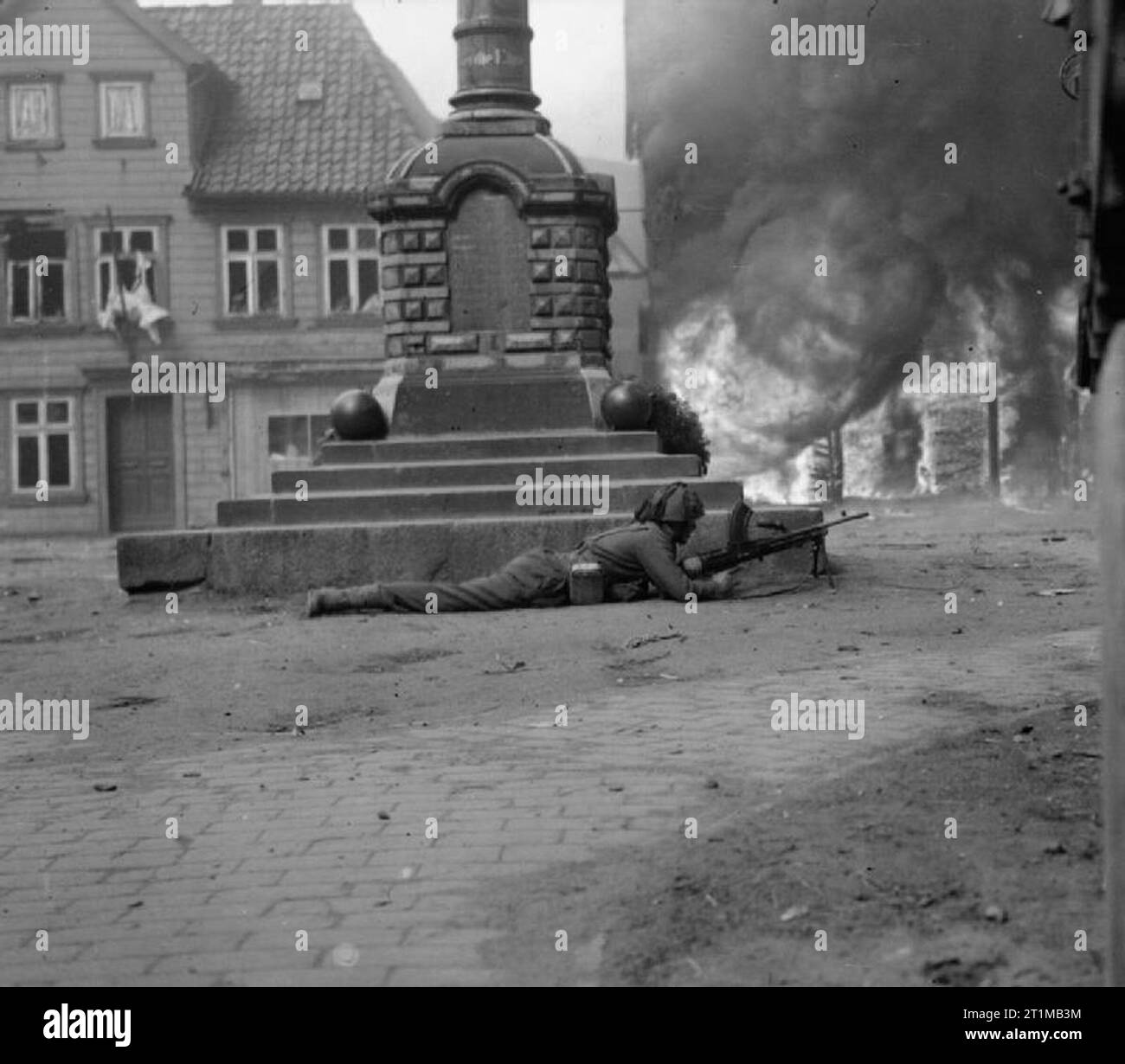 The British Army in North-west Europe 1944-45 A Bren gunner takes cover ...
