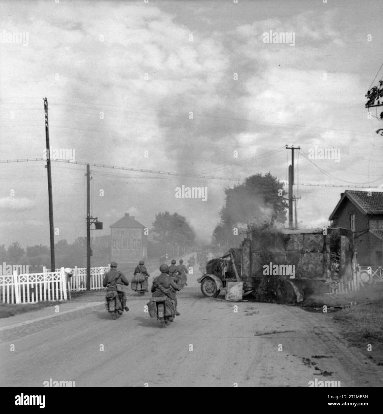 The British Army in North-west Europe 1944-45 Motorcyclists pass a ...