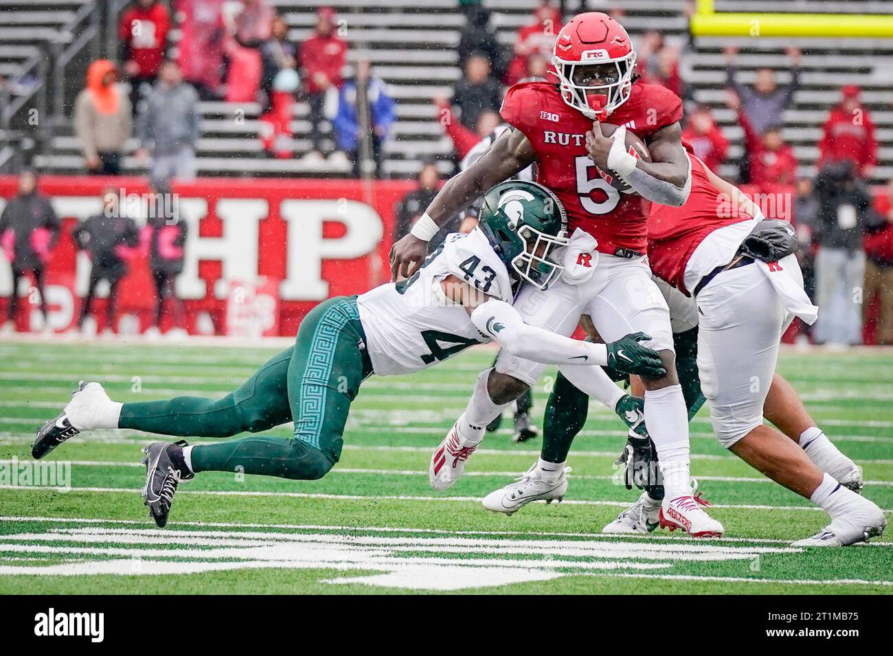 Rutgers running back Kyle Monangai (5) is tackled by Michigan State ...