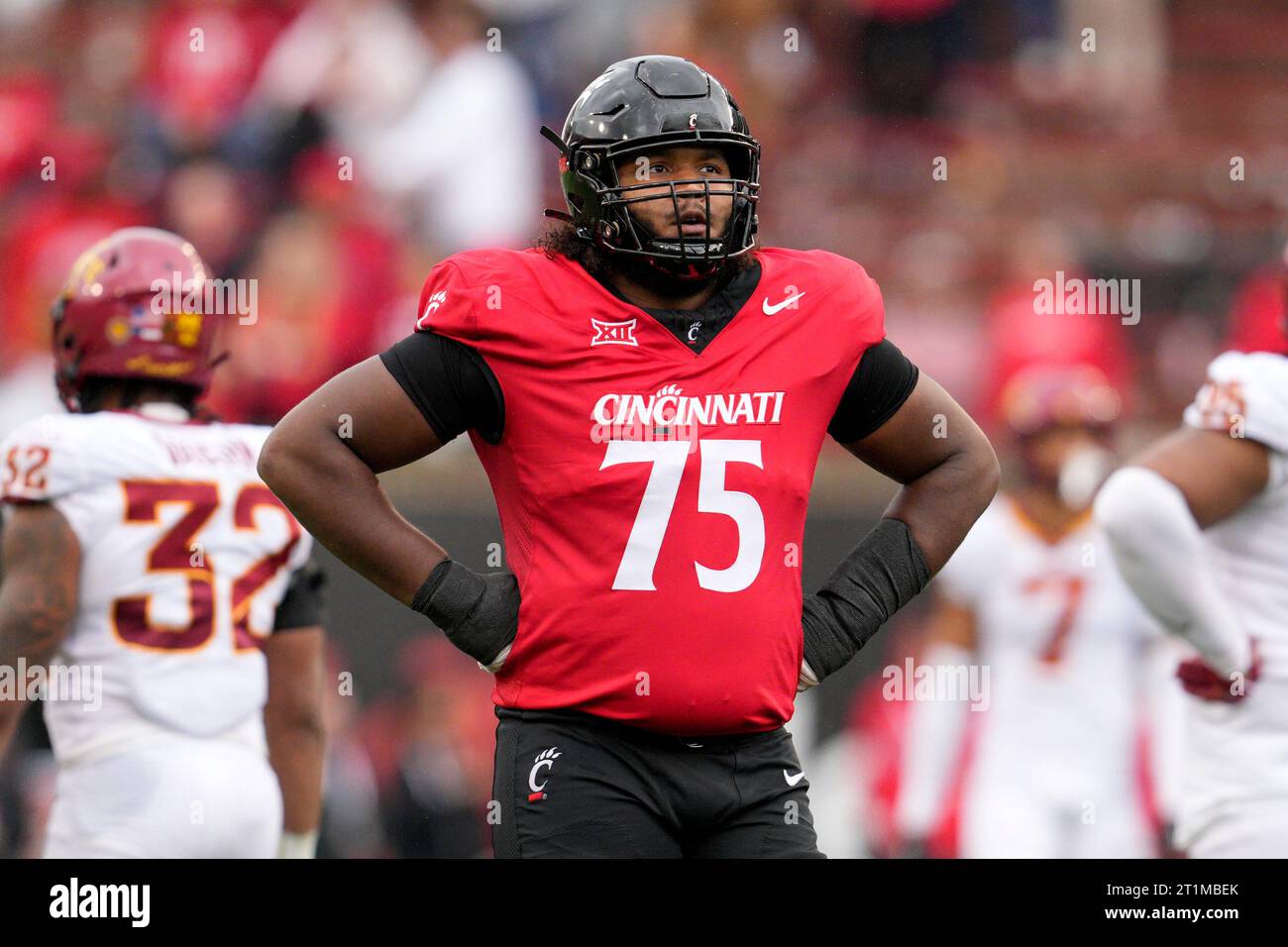 Cincinnati offensive lineman John Williams (75) reacts after a holding ...