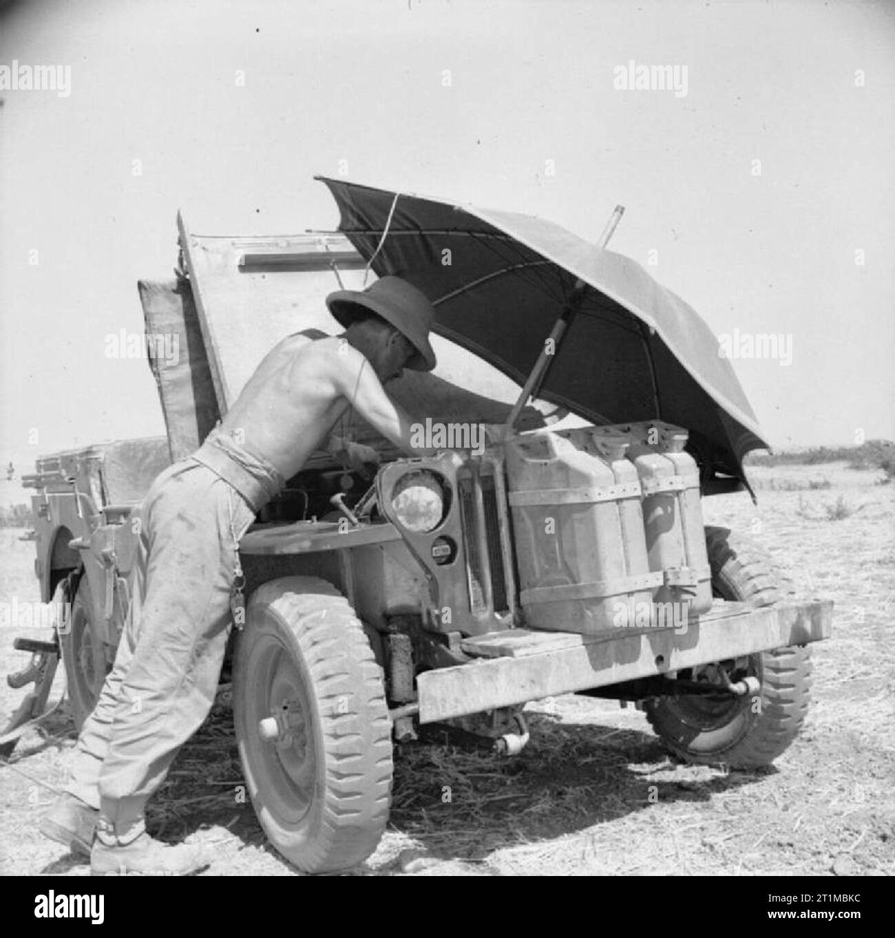 The British Army in Sicily 1943 Signaller W Bale working on his jeep ...