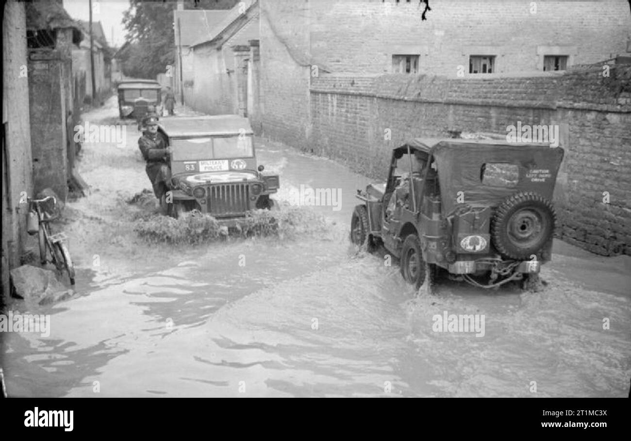 The British Army in the Normandy Campaign 1944 Jeeps passing in the ...